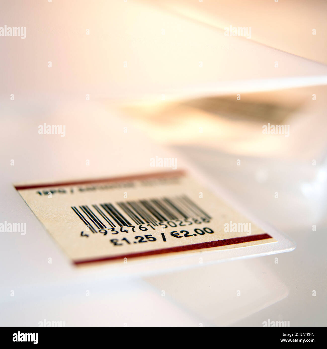 Barcoded price label. The price is given inboth British Pounds (GBP ...