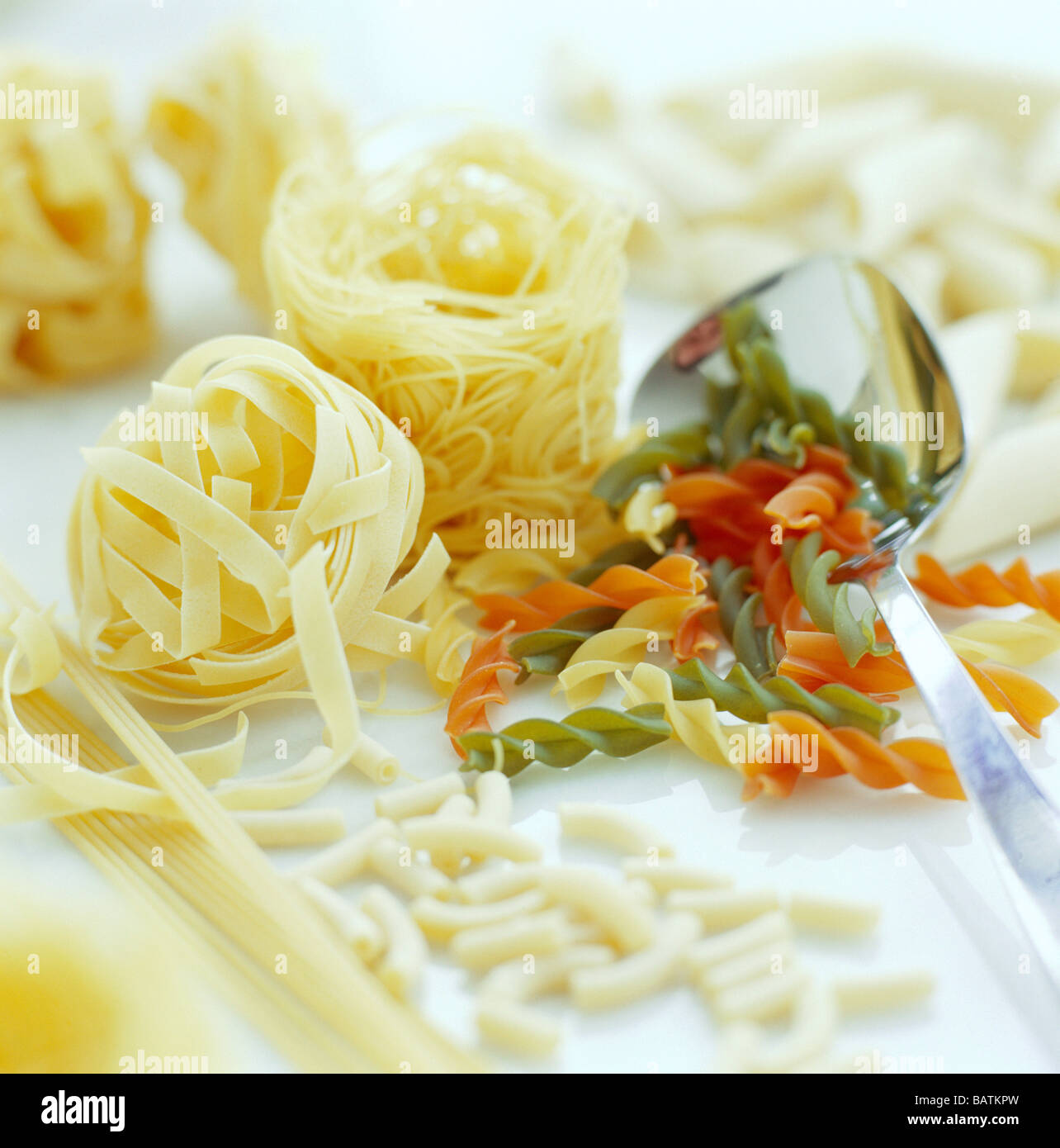 Dried pasta. Assortment of pasta shapes with ametal spoon Stock Photo ...
