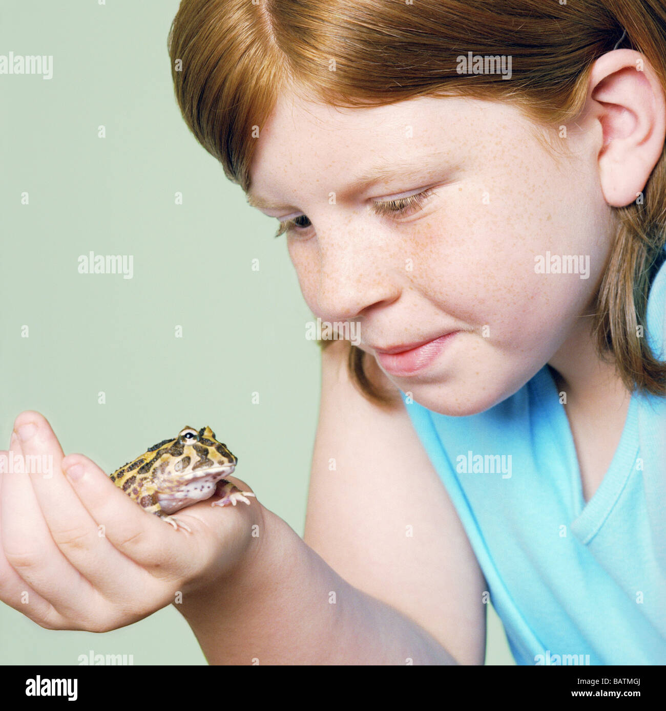 Girl holding his pet toad Stock Photo - Alamy