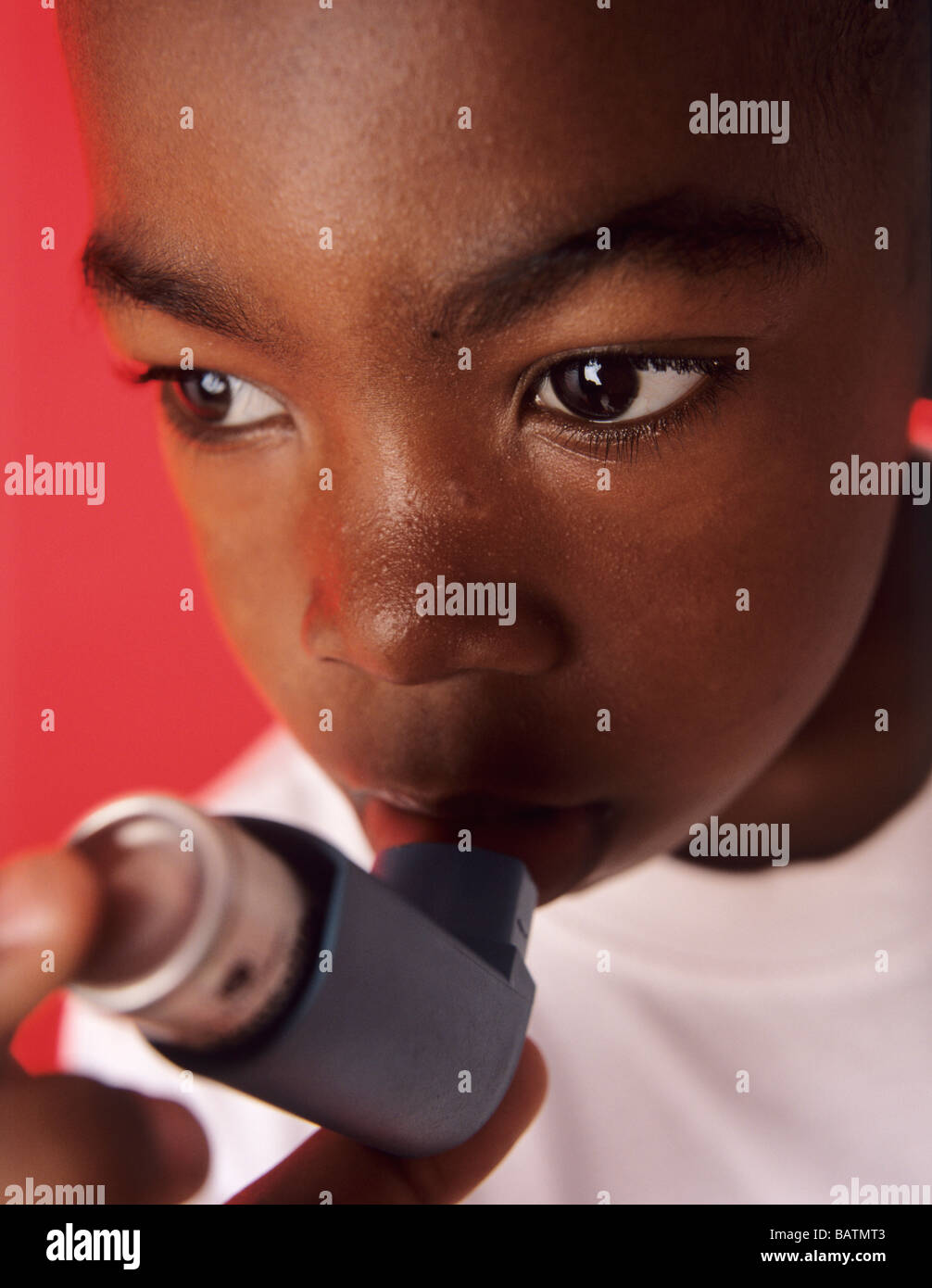 A child using an inhaler for the treatment of asthma hi-res stock ...