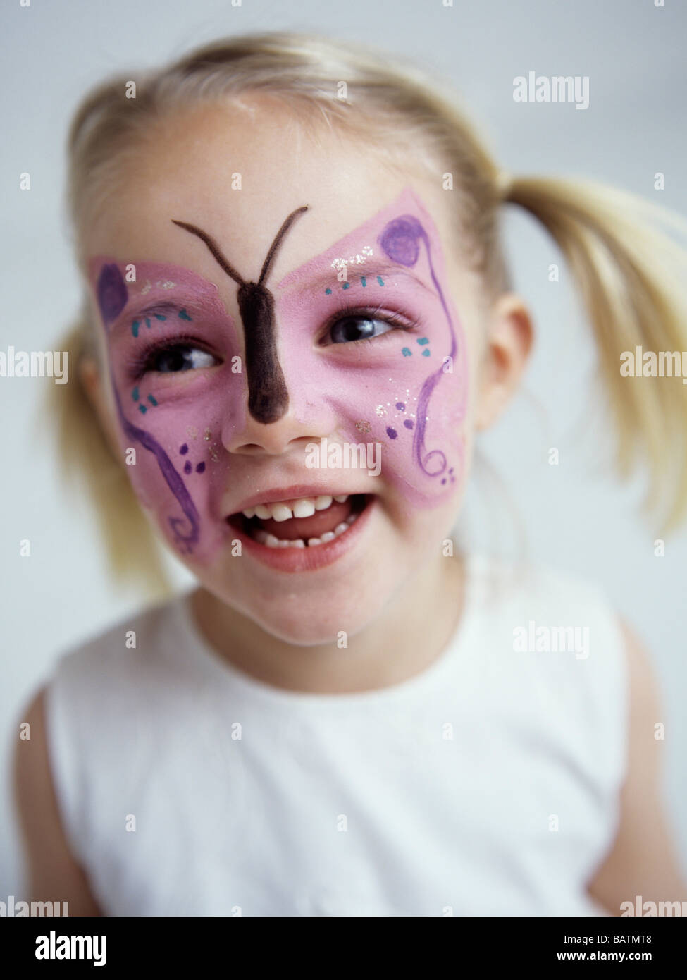 Face painting. 3-year-old girl who has had her face painted with a ...