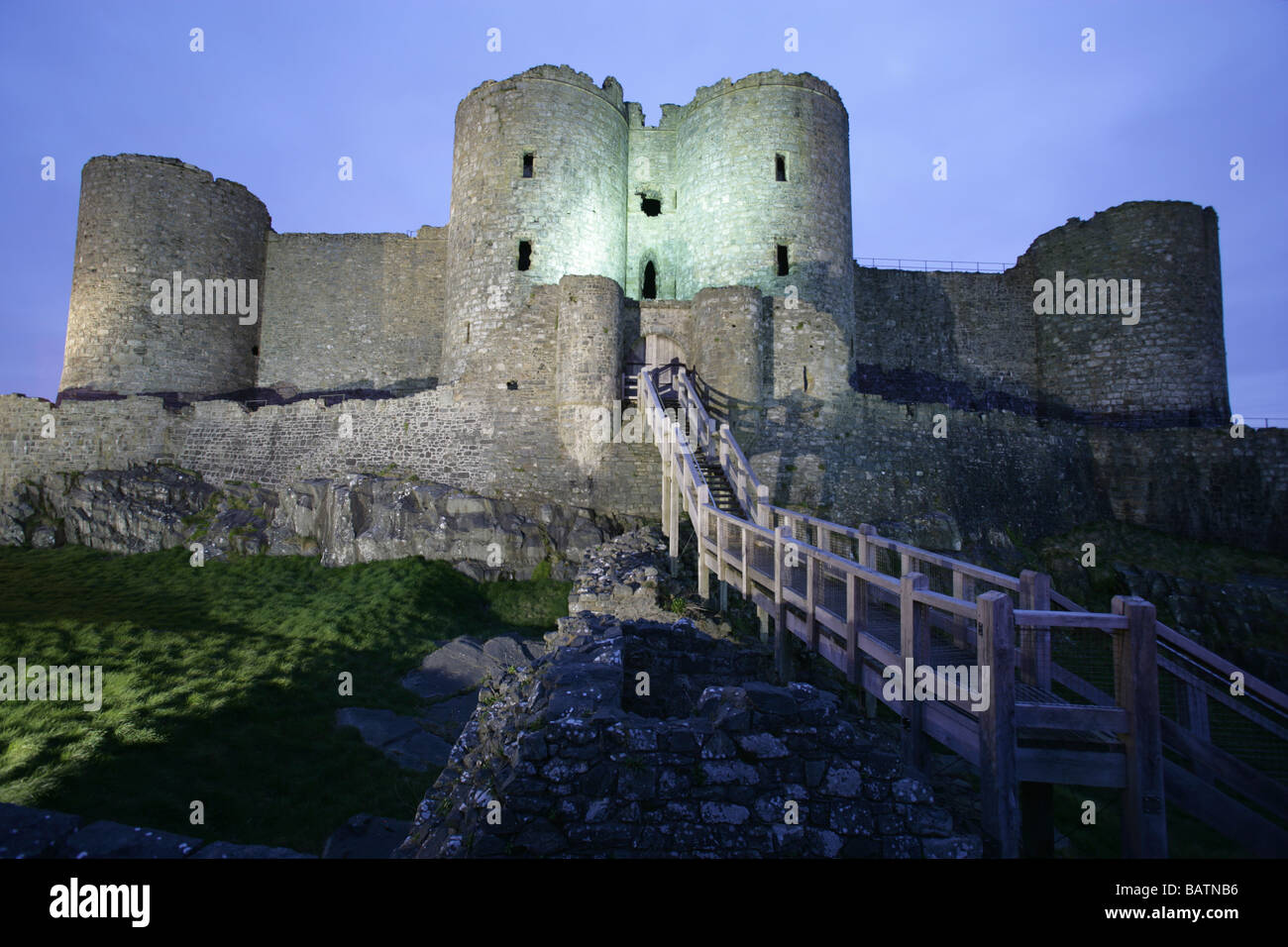 Town of Harlech, Wales. Night floodlit view of the east elevation and ...