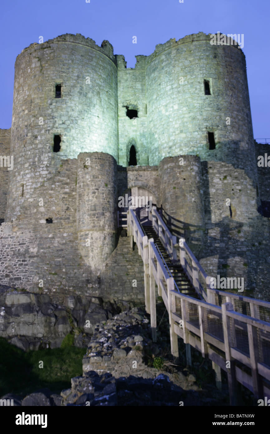 Town of Harlech, Wales. Night floodlit view of the east elevation and ...