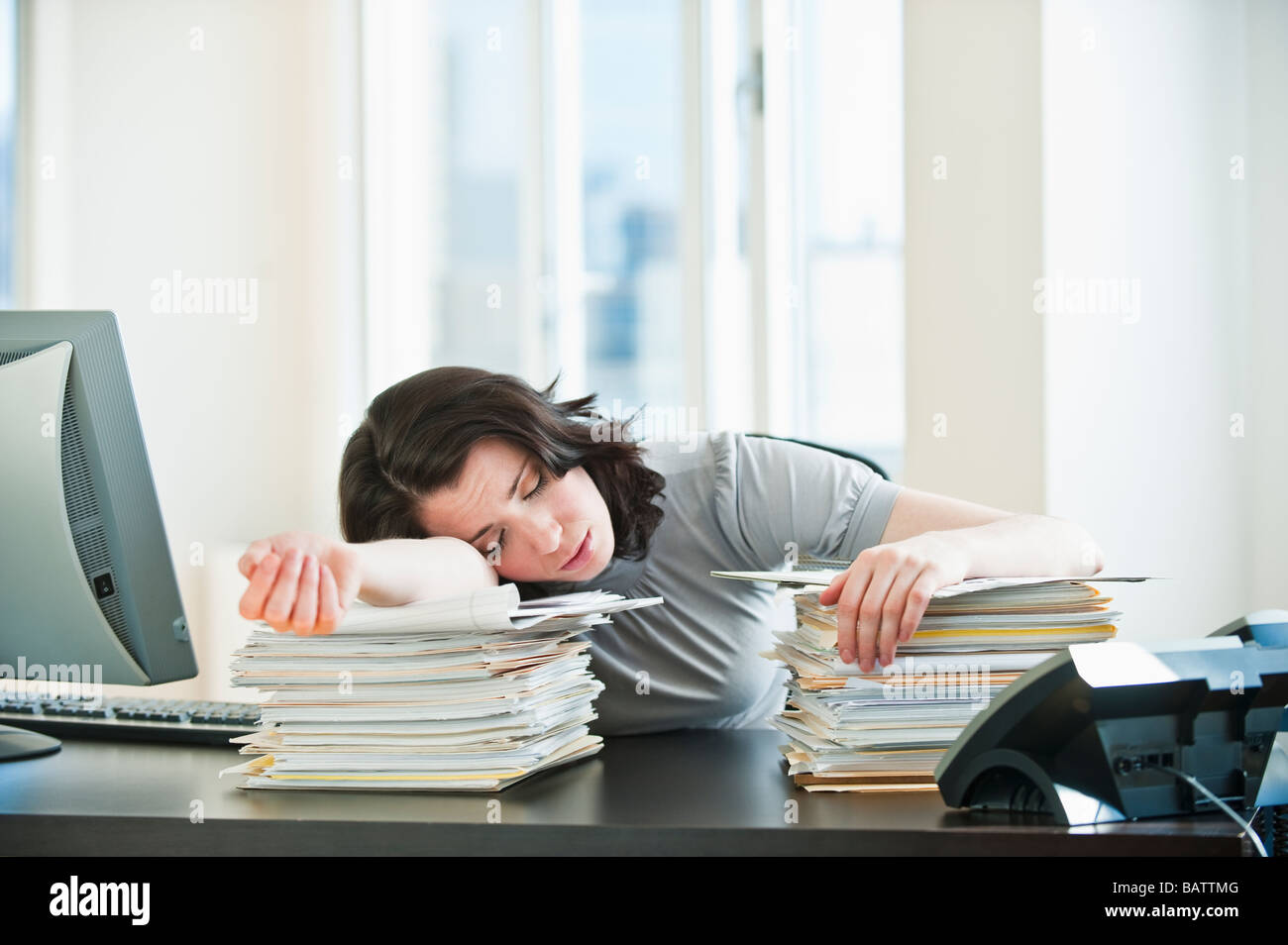 Business woman sleeping on paperwork at desk in office Stock Photo - Alamy
