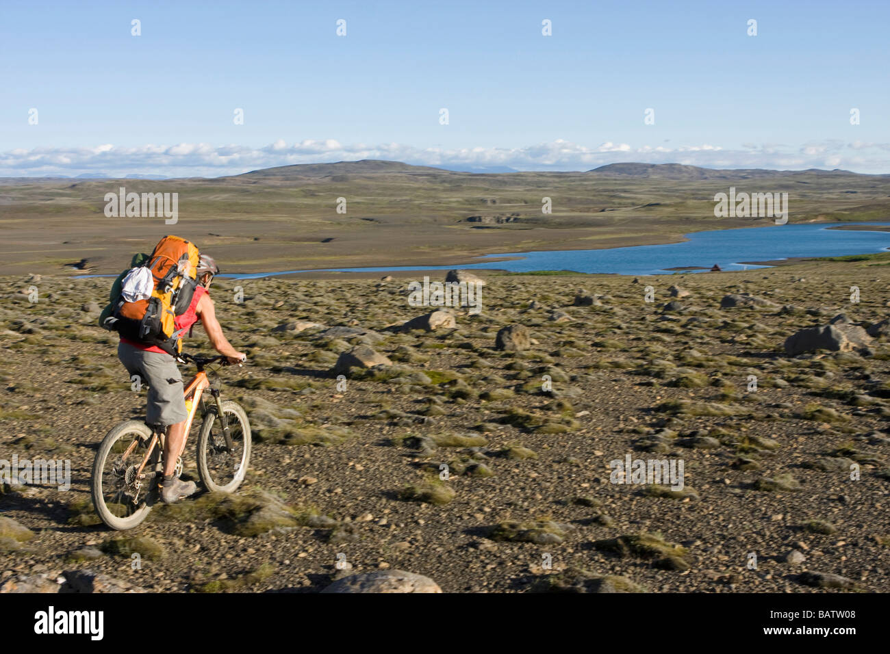 Iceland, Man mountain biking across lowland Stock Photo - Alamy
