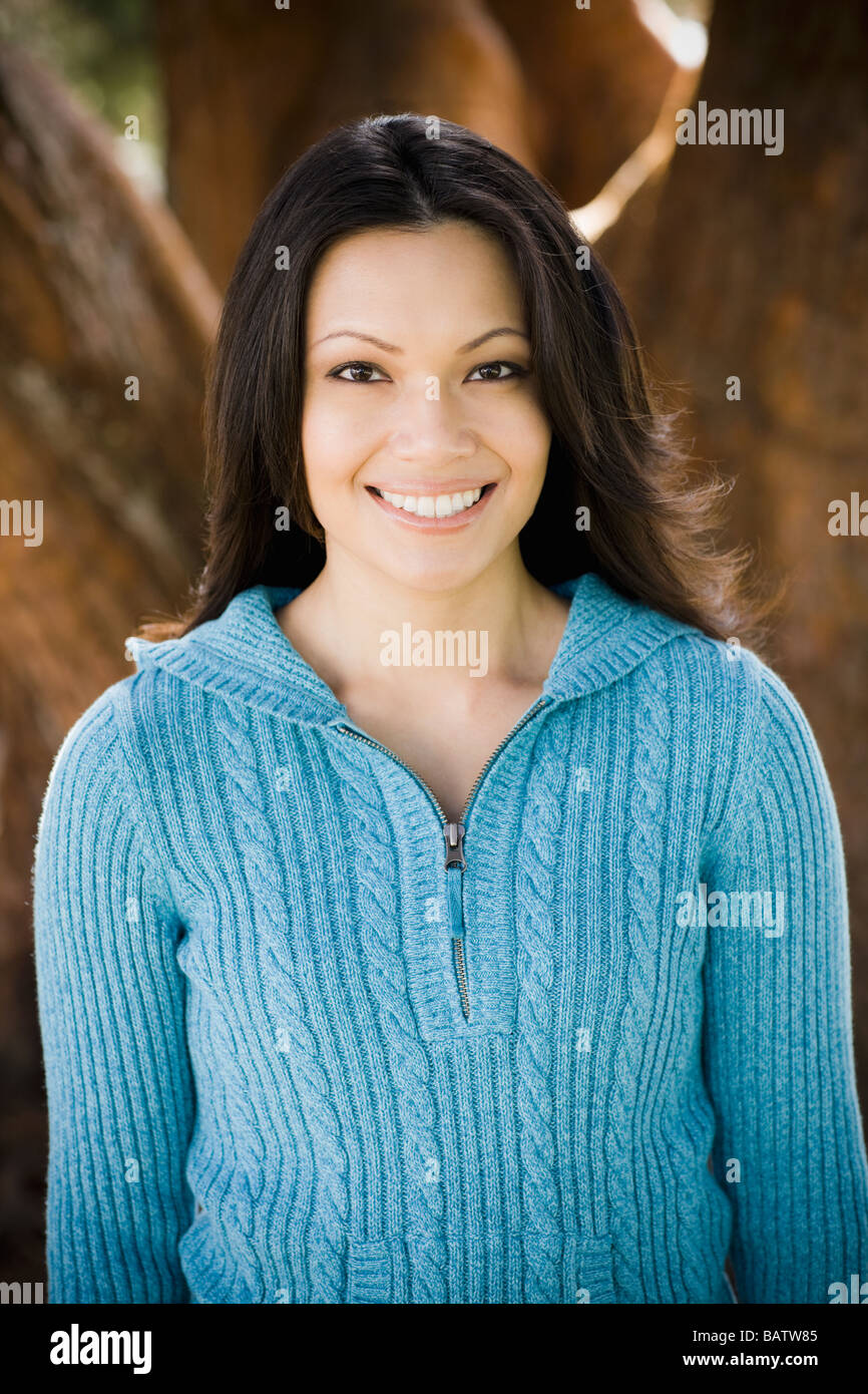 Portrait of woman in park Stock Photo - Alamy