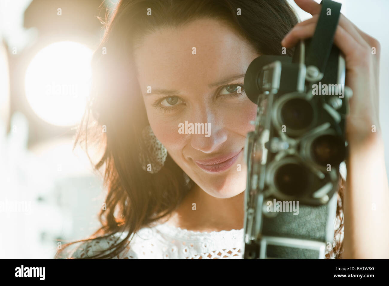 Portrait of female filmmaker using film camera Stock Photo - Alamy