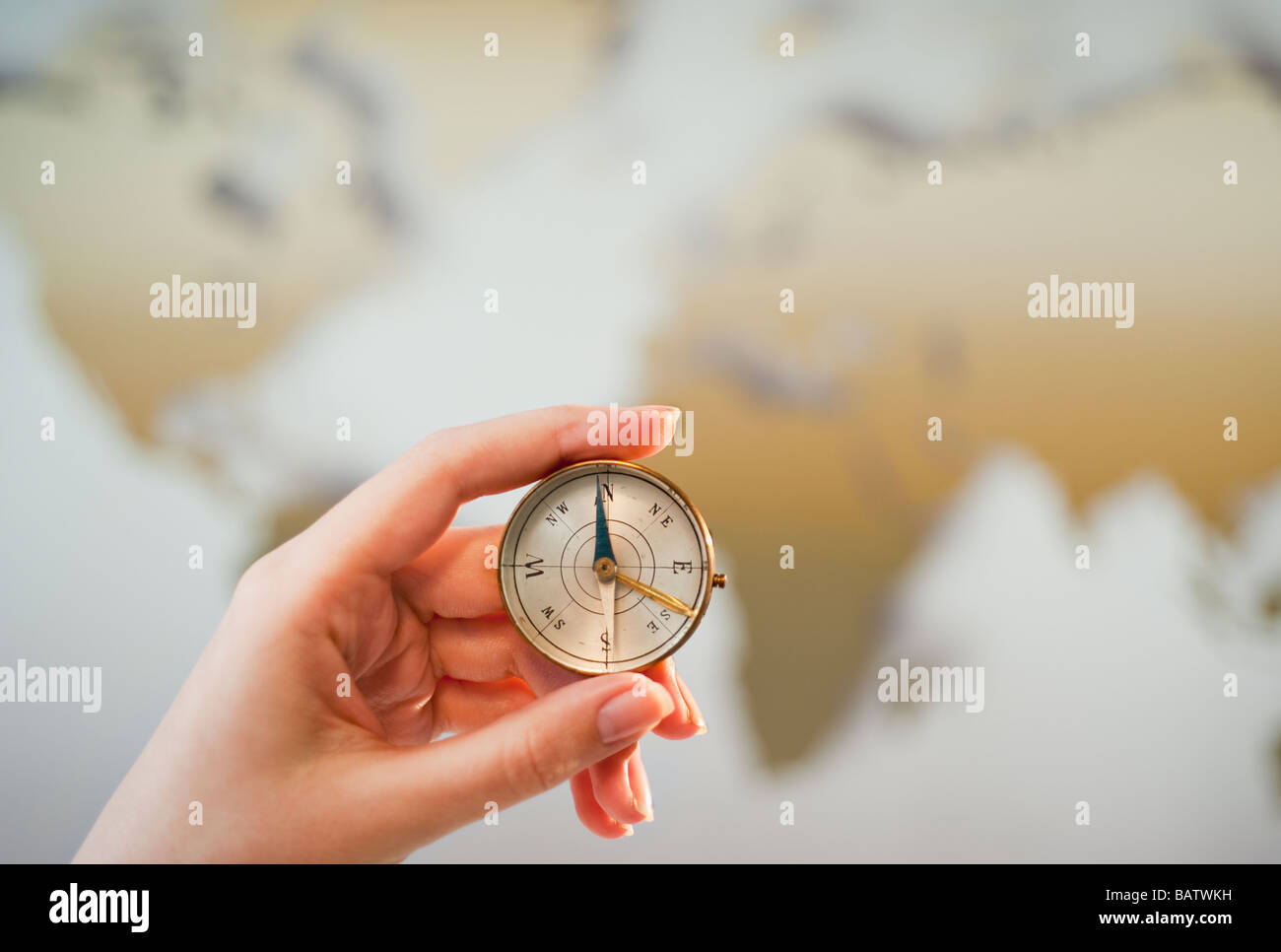 Woman holding compass, close-up Stock Photo - Alamy