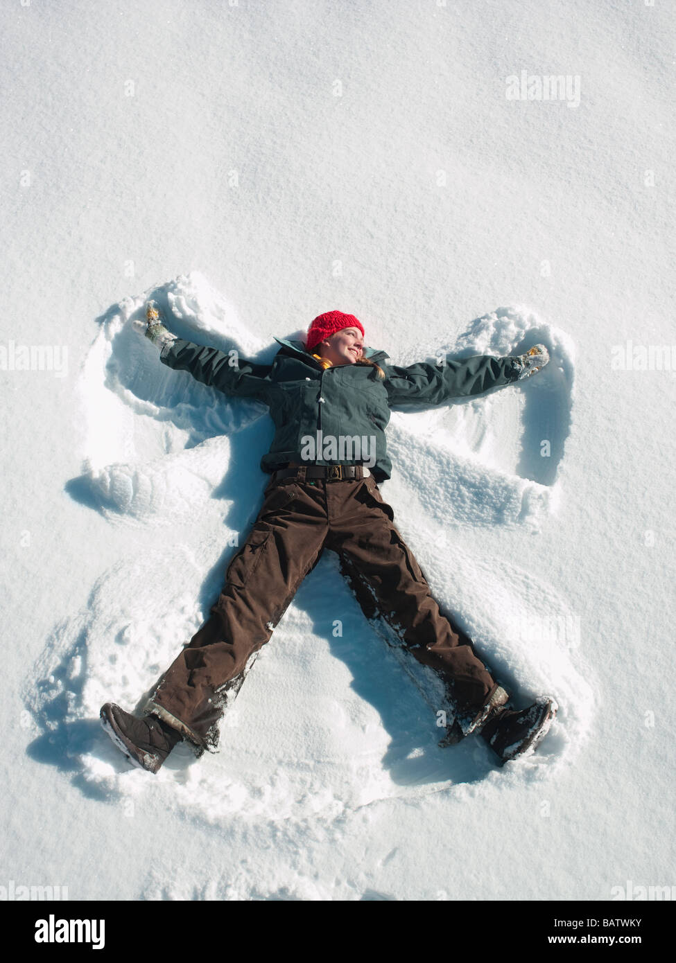 Woman making snow angel shape hi-res stock photography and images - Alamy