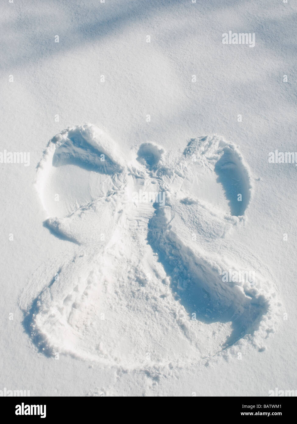 Snow angel shape Stock Photo - Alamy