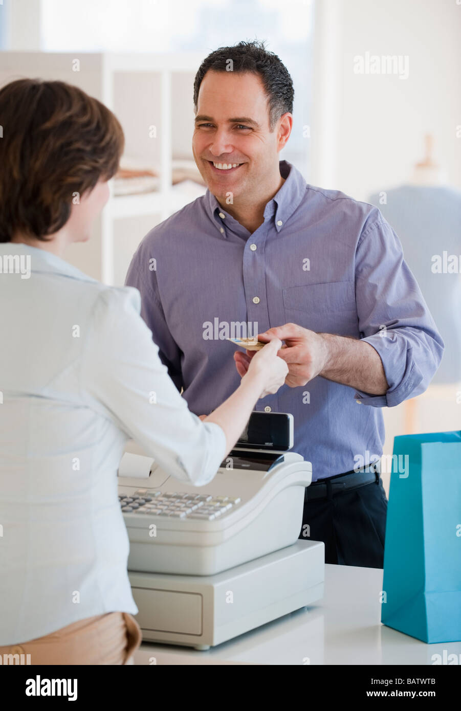 Paying at register hi-res stock photography and images - Alamy