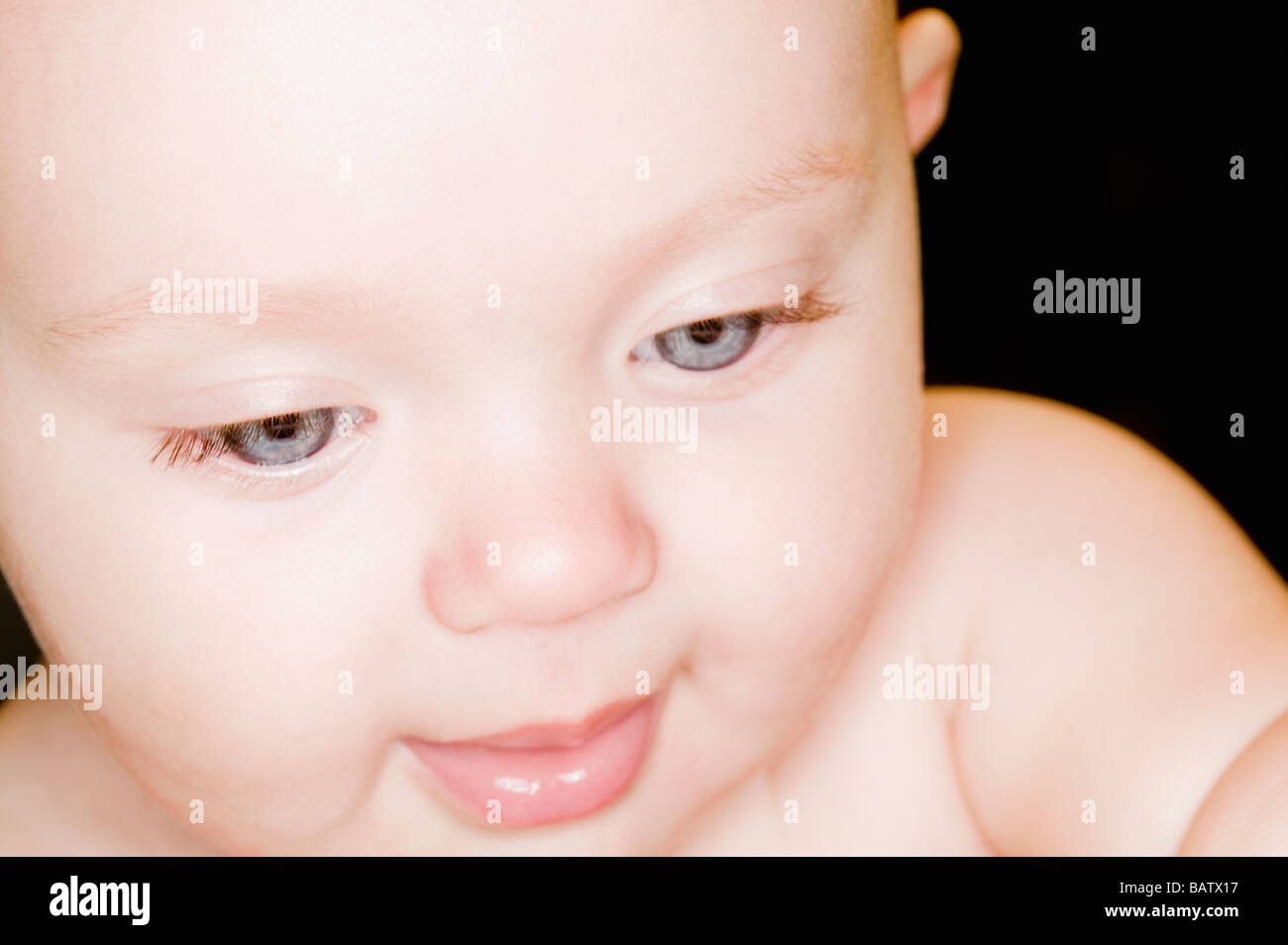 One baby looking down Stock Photo - Alamy