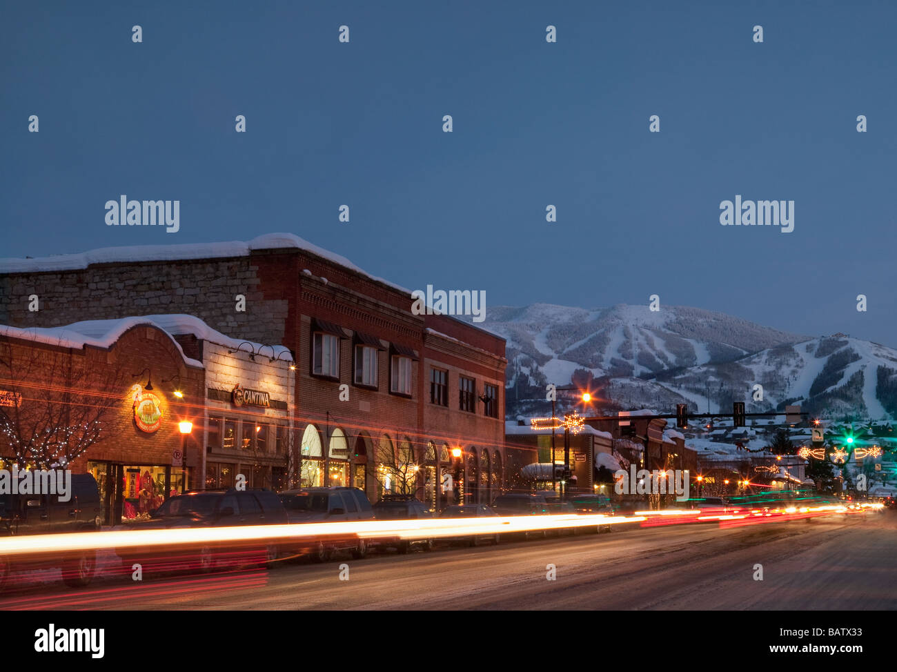 USA, Colorado, Steamboat Springs, Town at night with mountains in ...