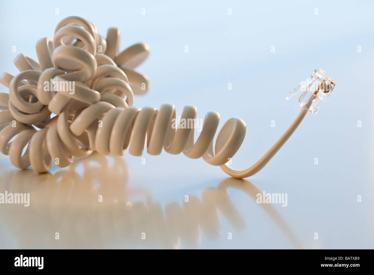 Studio shot of disconnected phone cord Stock Photo - Alamy