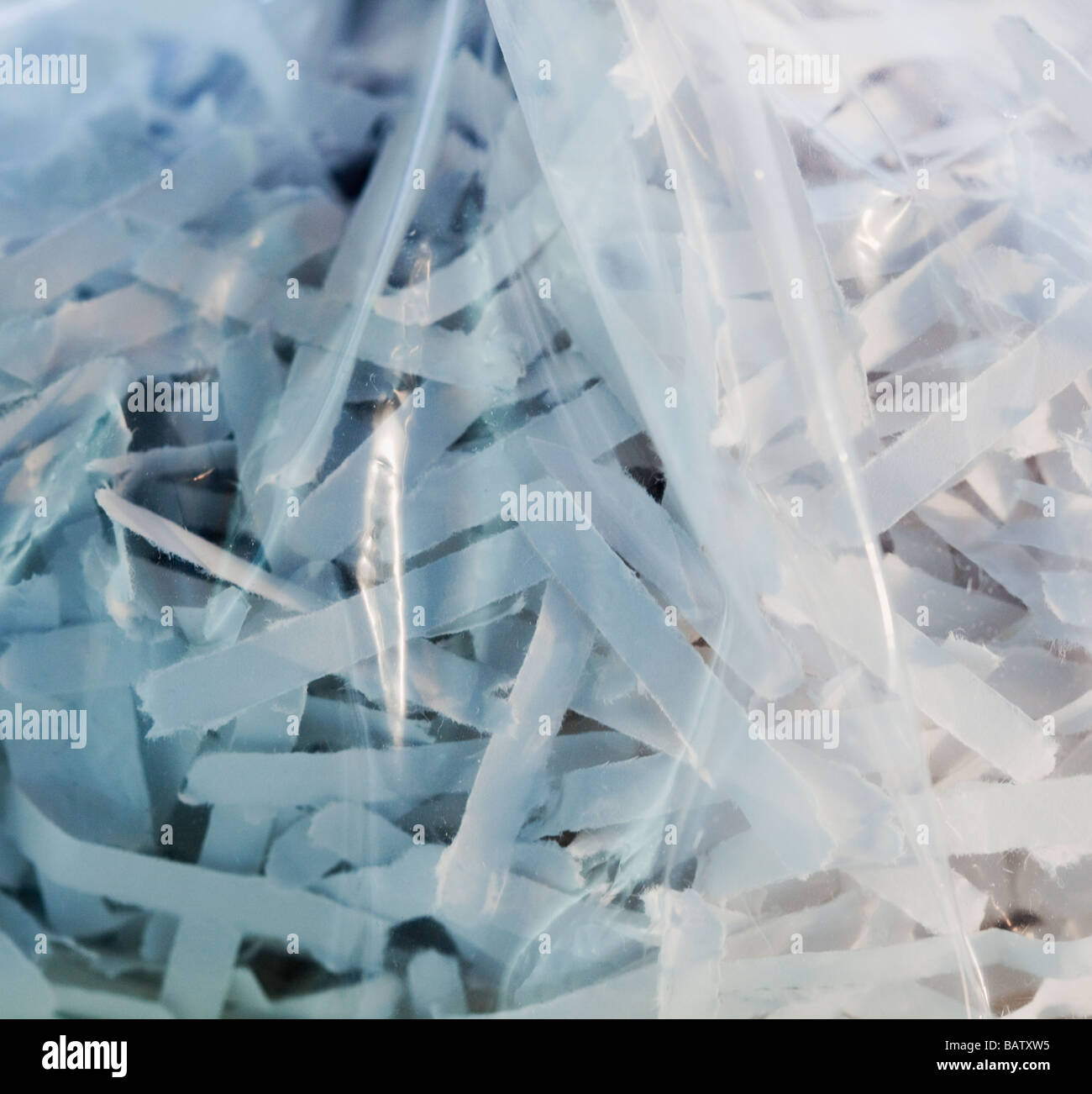 Shredded paper in plastic bag Stock Photo - Alamy