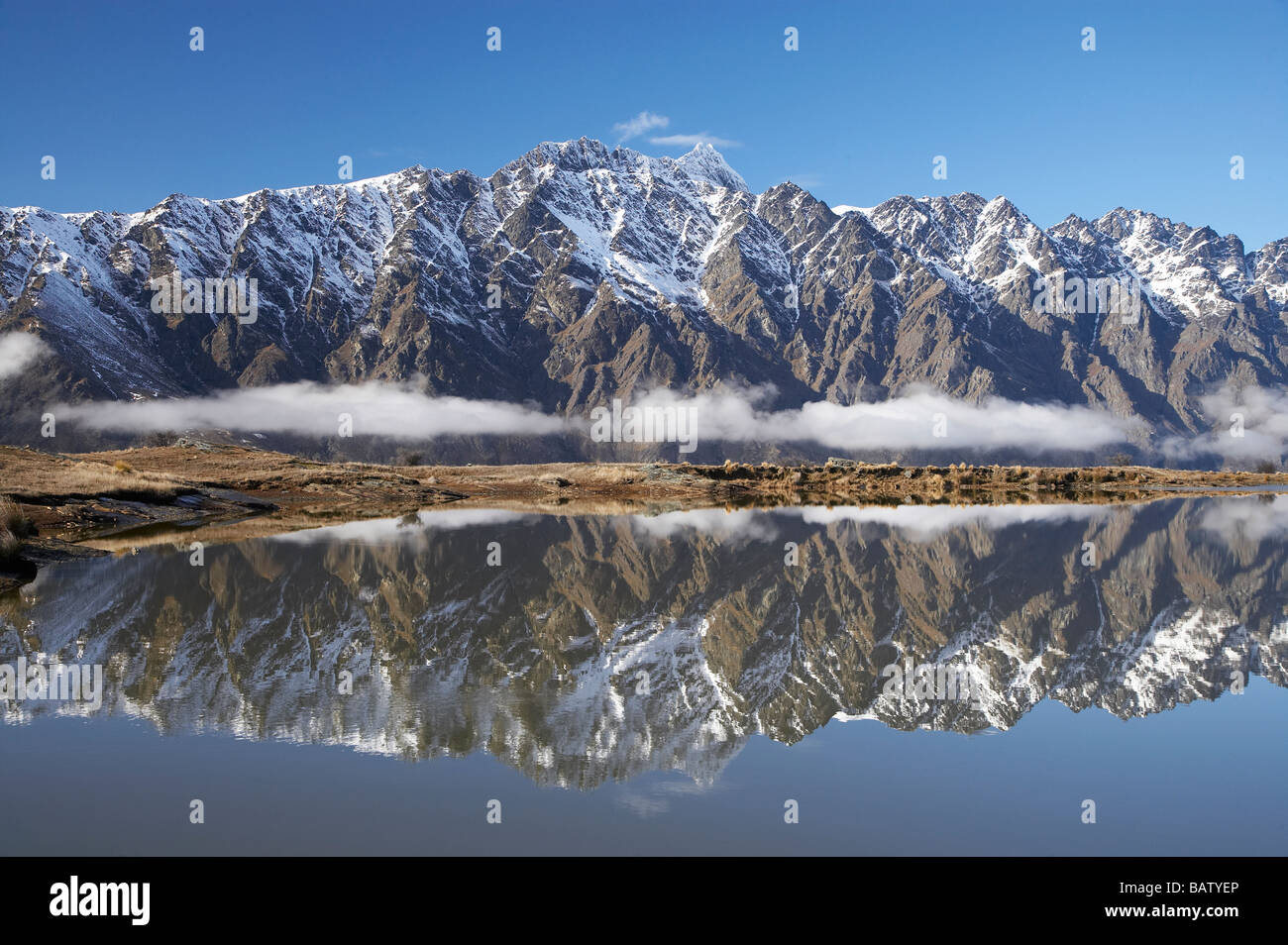 The Remarkables reflected in Summit Tarn Deer Park Heights near ...
