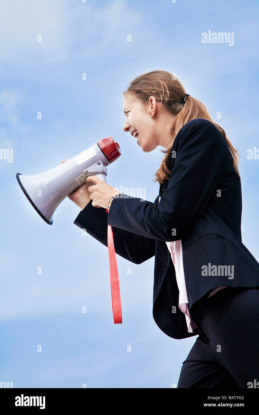 Woman shouting megaphone low hi-res stock photography and images - Alamy