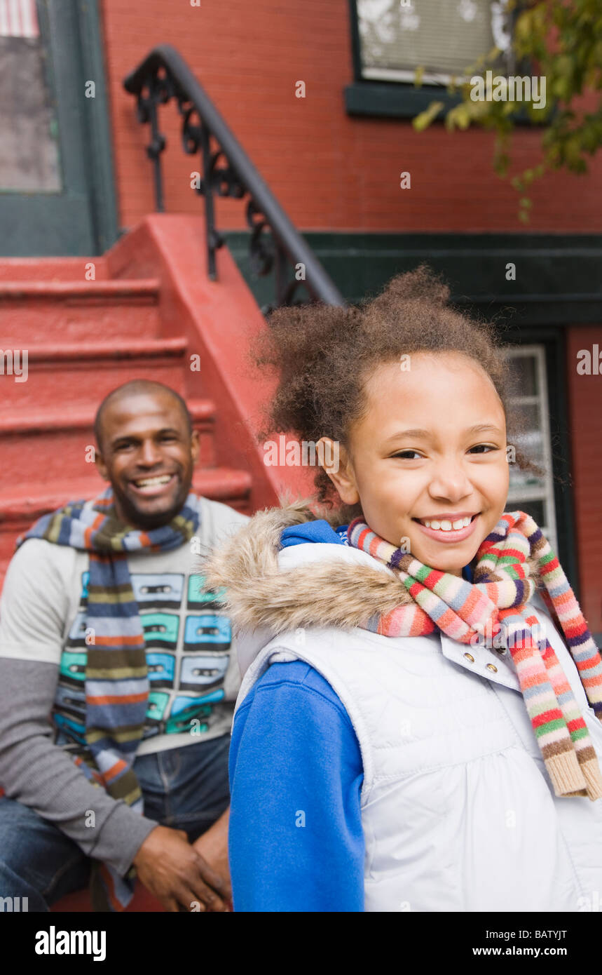 African father and daughter on front stoop Stock Photo - Alamy