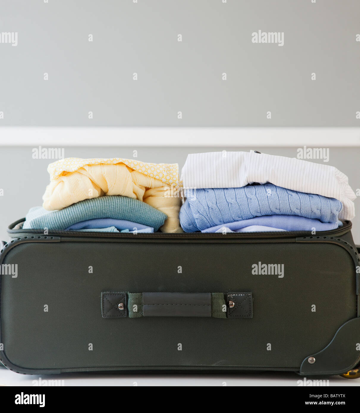 Close-up of packed suitcase Stock Photo - Alamy