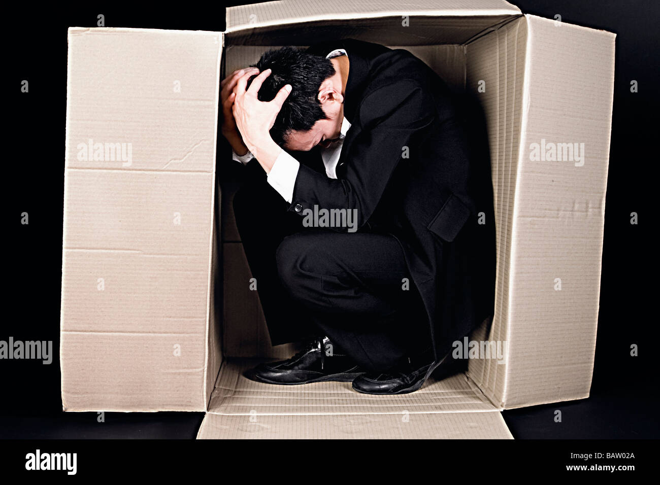 Man hiding inside cardboard box hi-res stock photography and images - Alamy