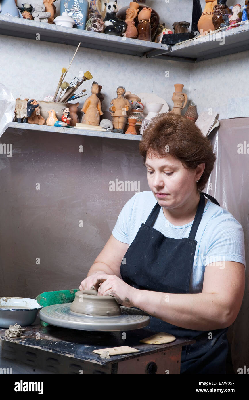 female potter working in her workshop Stock Photo - Alamy