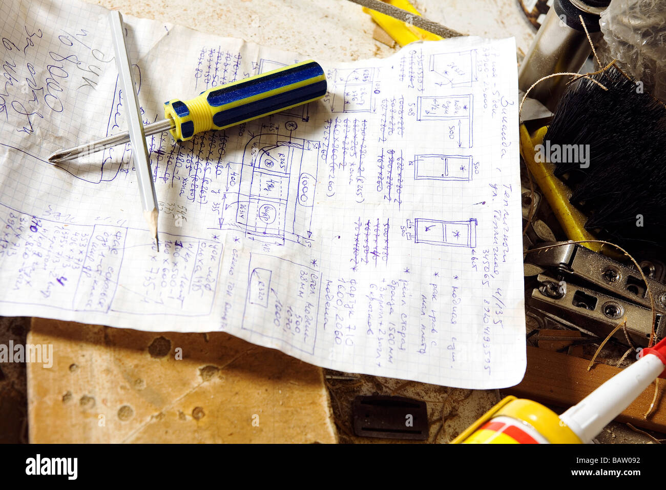 still life of screwdriver pencil and blueprint Stock Photo - Alamy