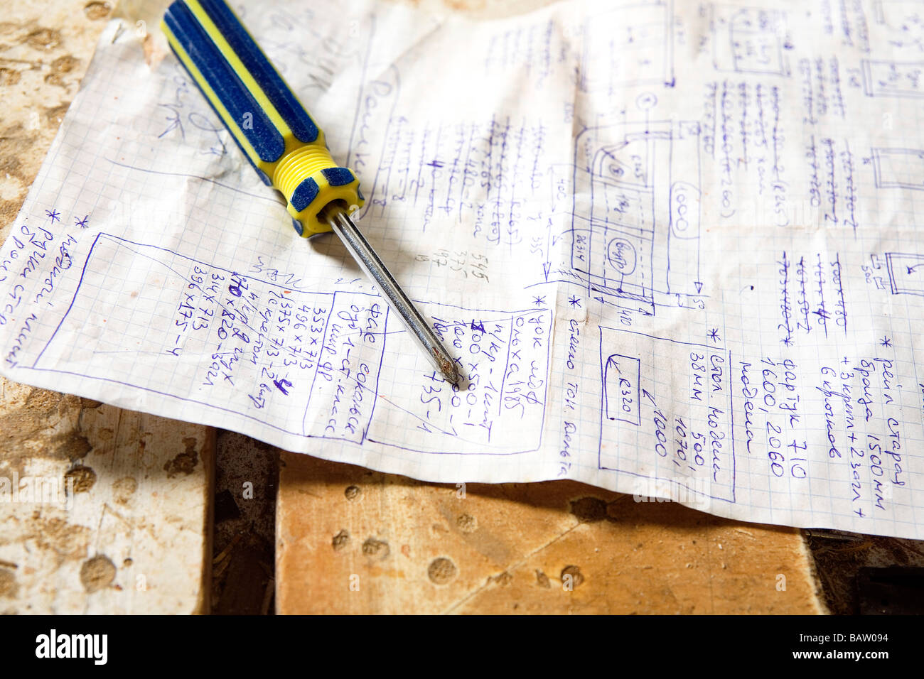 still life of screwdriver and blueprint Stock Photo - Alamy