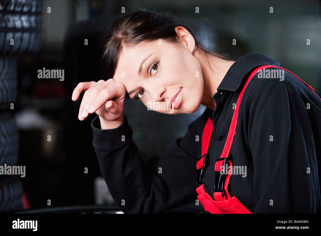 portrait of exhausted female mechanic Stock Photo - Alamy