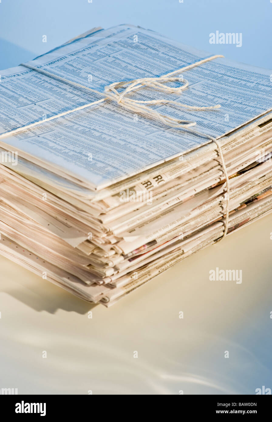 Pile of newspapers for recycling, studio shot Stock Photo - Alamy