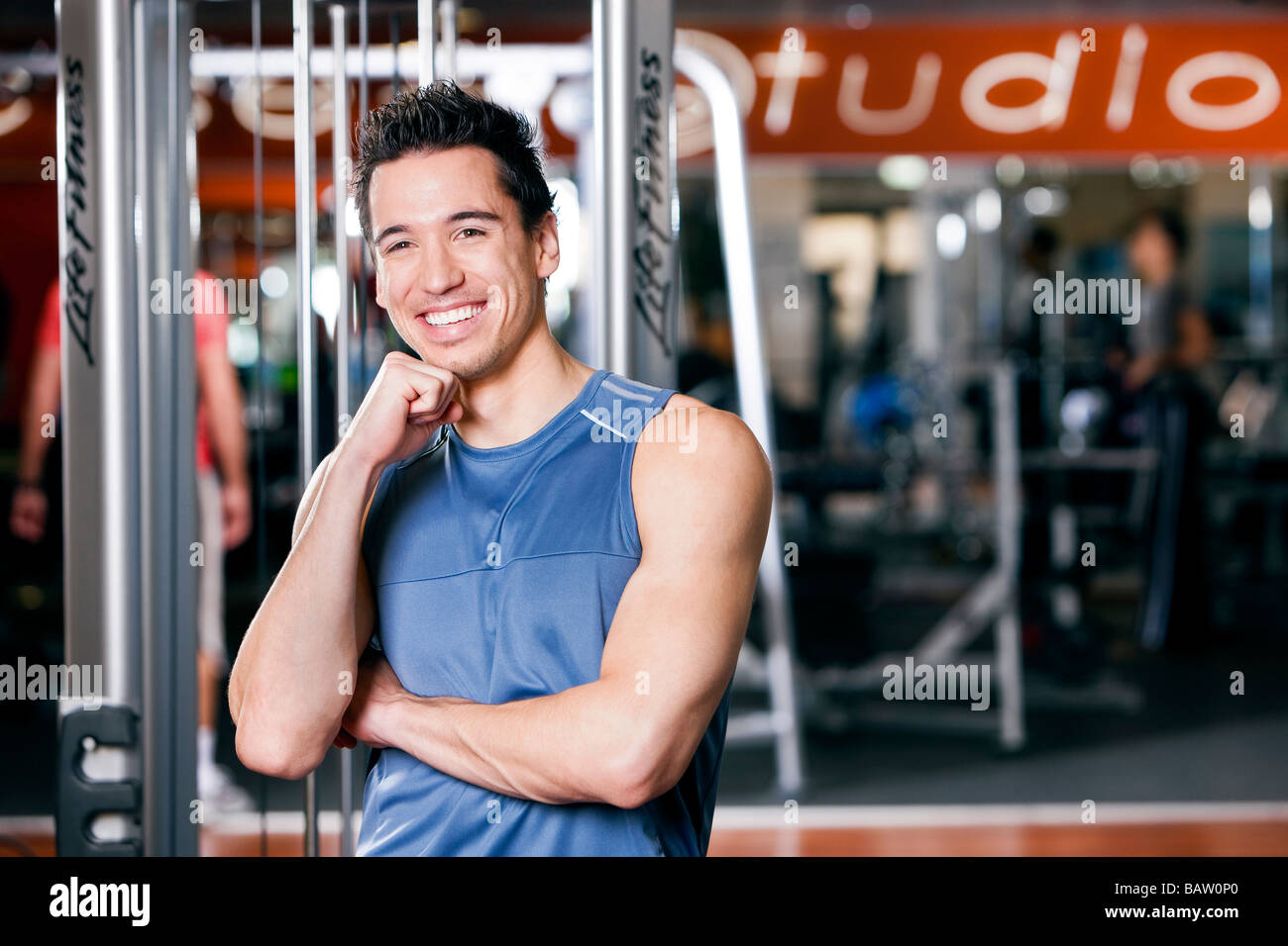 young man posing for portrait in gym Stock Photo - Alamy