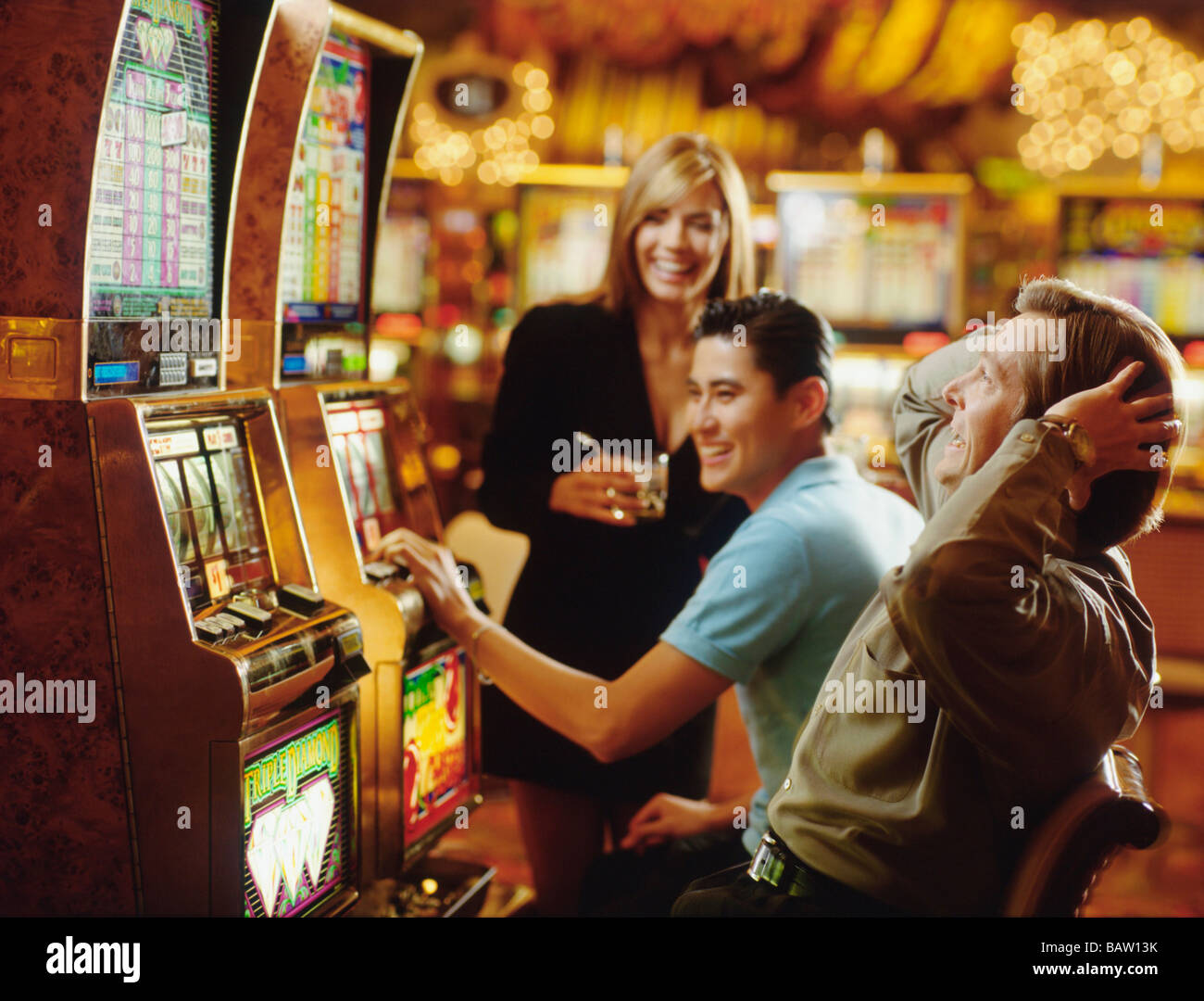 People in casino playing on slot machines Stock Photo - Alamy