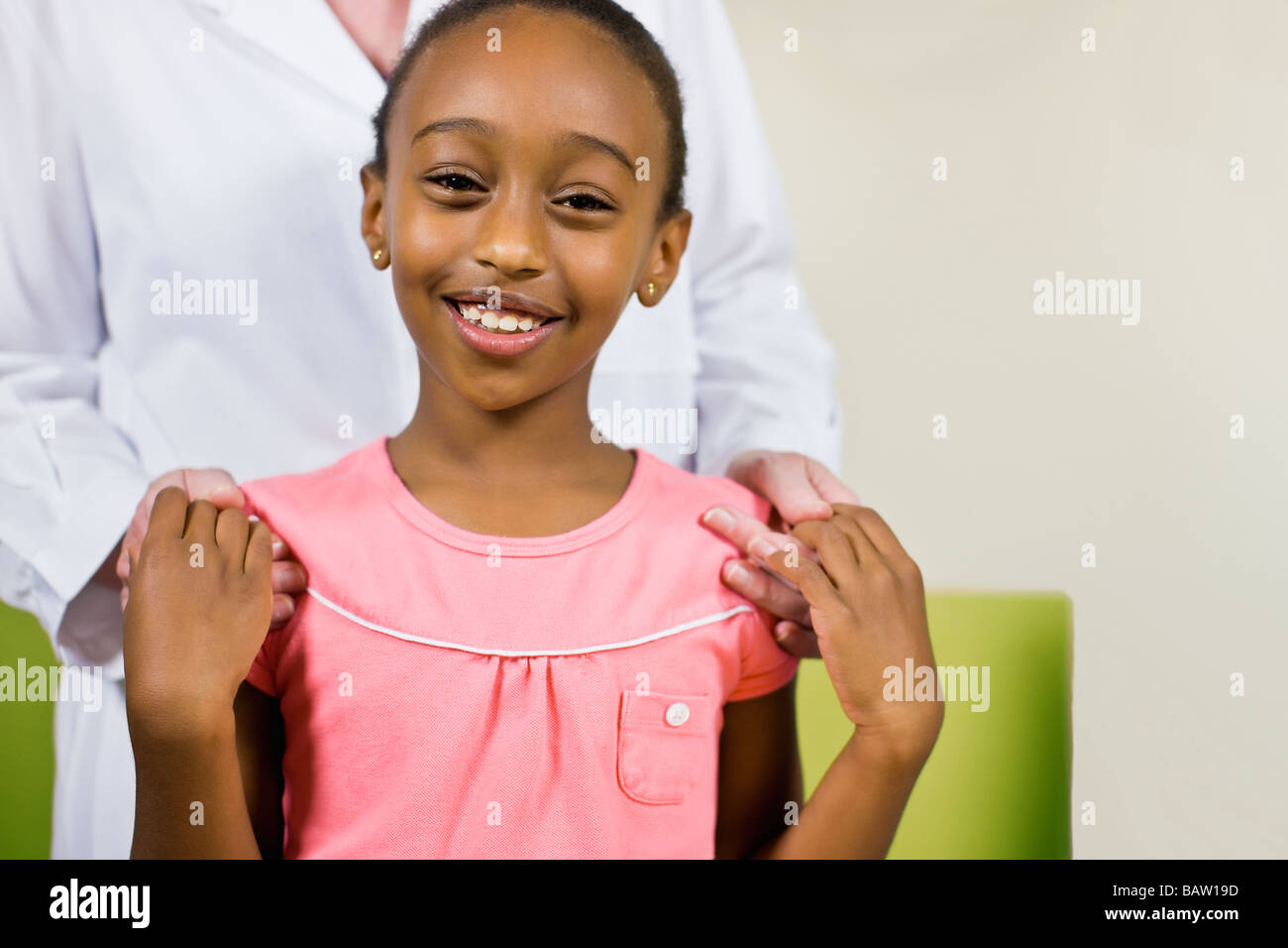 African girl holding hands with woman Stock Photo - Alamy