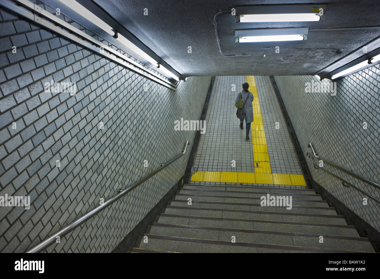 Person walking through a underground Stock Photo - Alamy