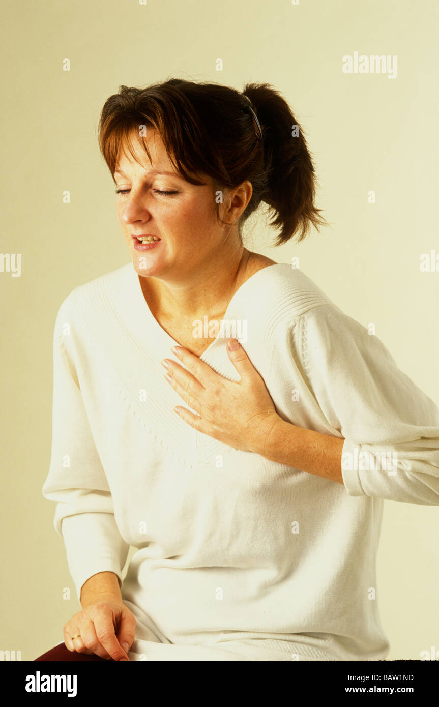 woman having palpitations or breathlessness or indigestion Stock Photo ...