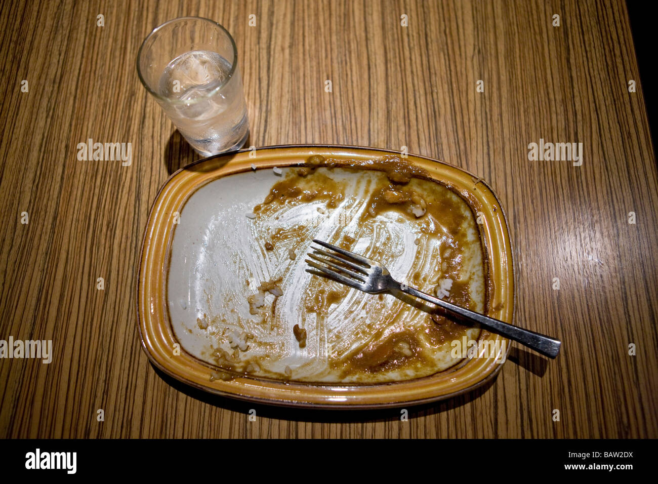 Finished food on wooden table Stock Photo - Alamy