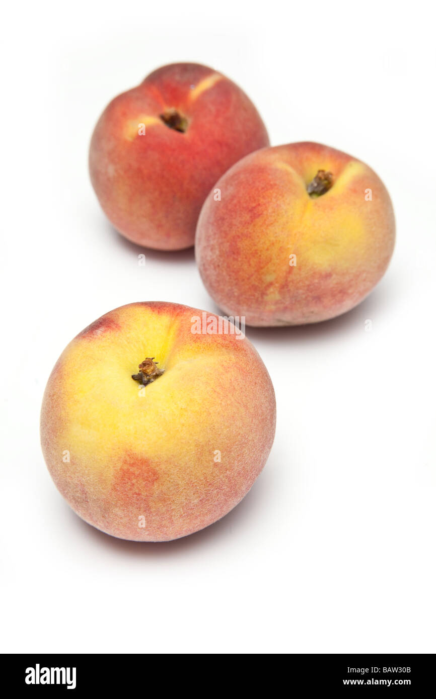 Peaches isolated on a white studio background Stock Photo - Alamy