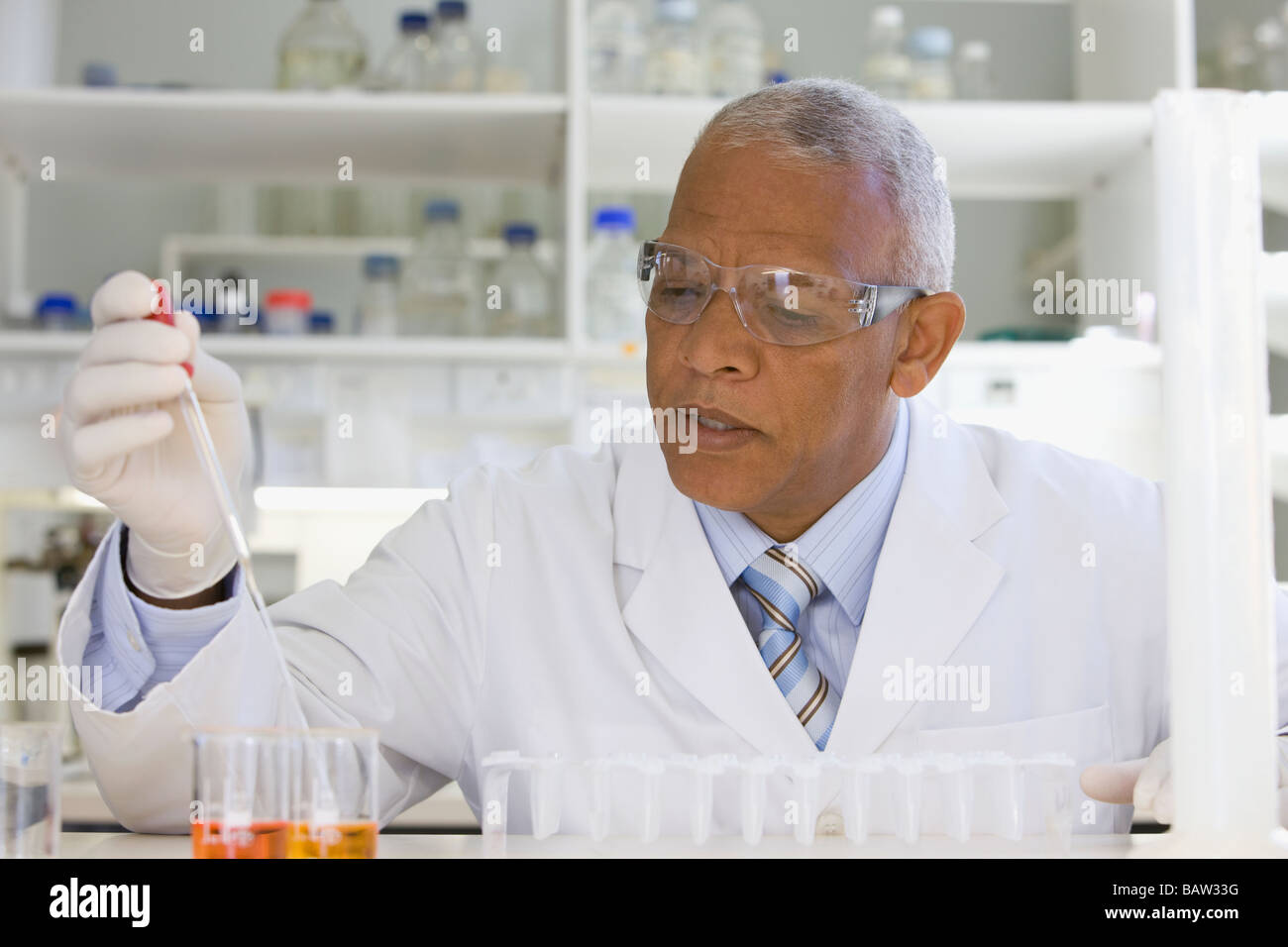 African scientist performing analysis in laboratory Stock Photo - Alamy