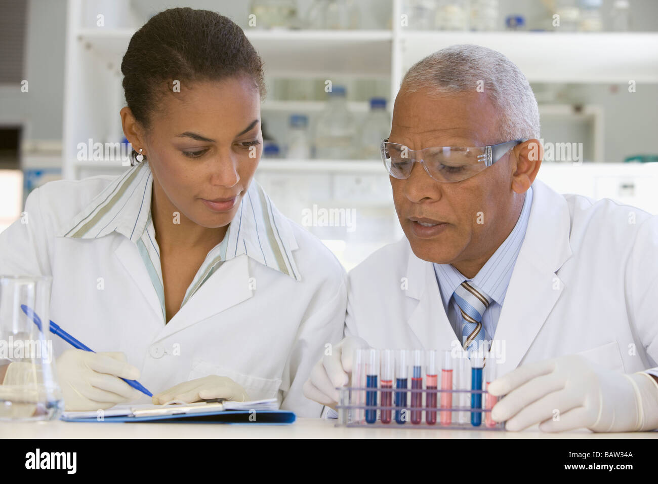 African scientists performing analysis in laboratory Stock Photo - Alamy
