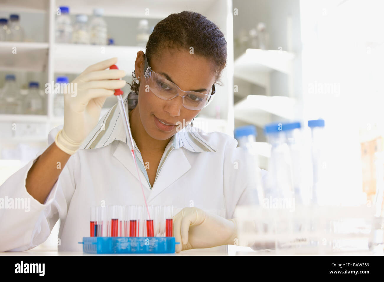 African scientist performing analysis in laboratory Stock Photo - Alamy