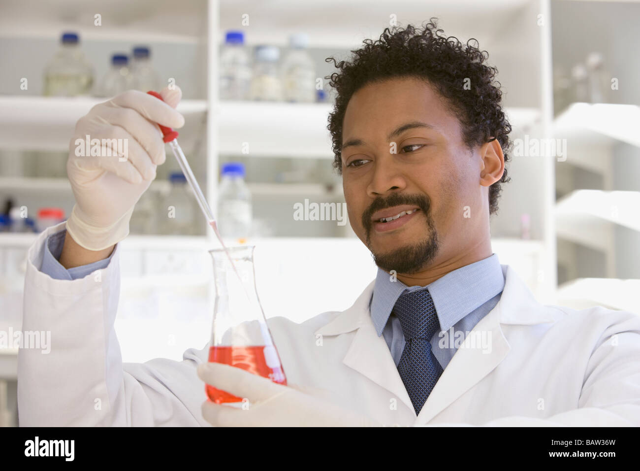 African scientist performing analysis in laboratory Stock Photo - Alamy