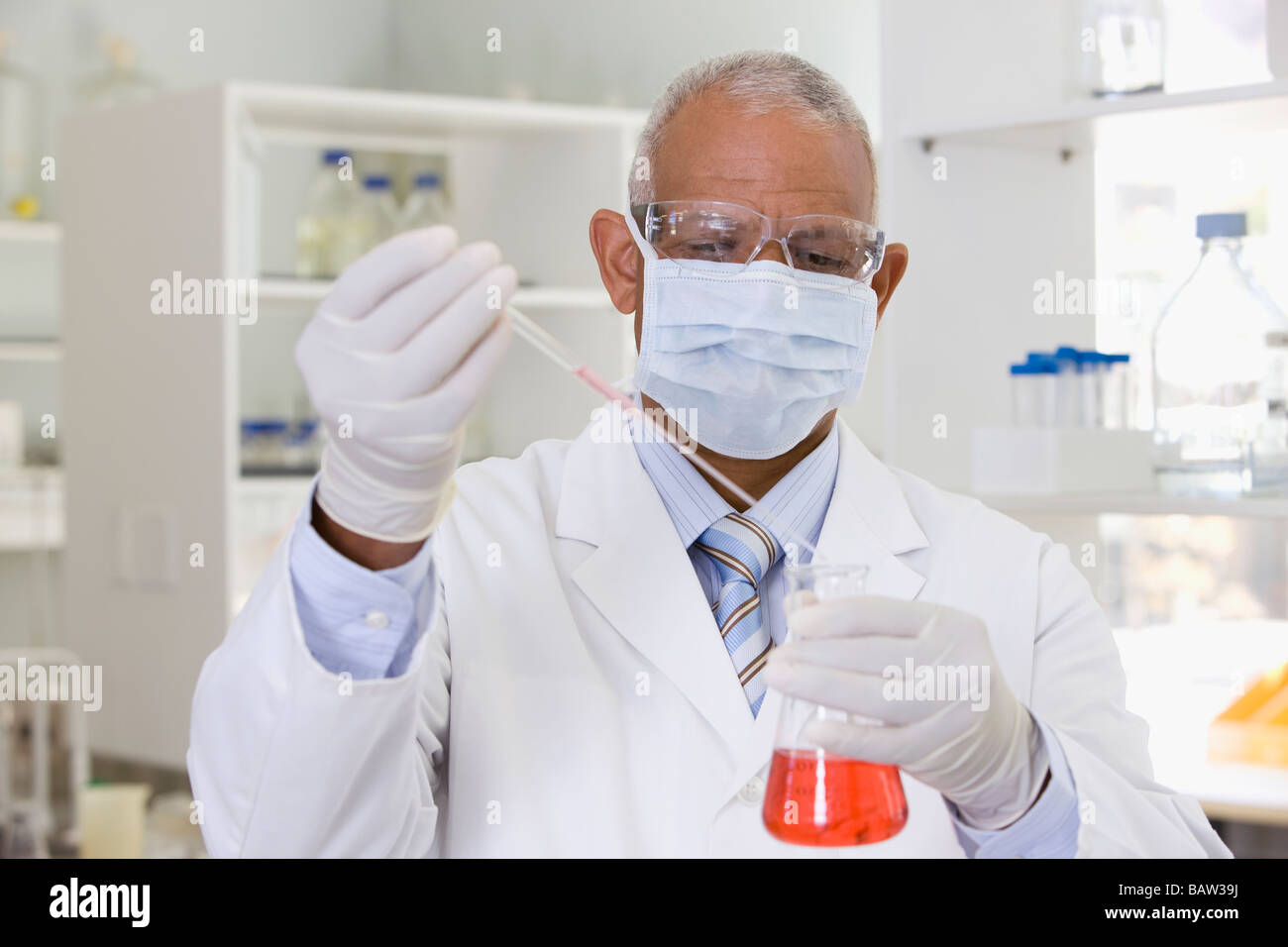 African scientist performing analysis in laboratory Stock Photo - Alamy
