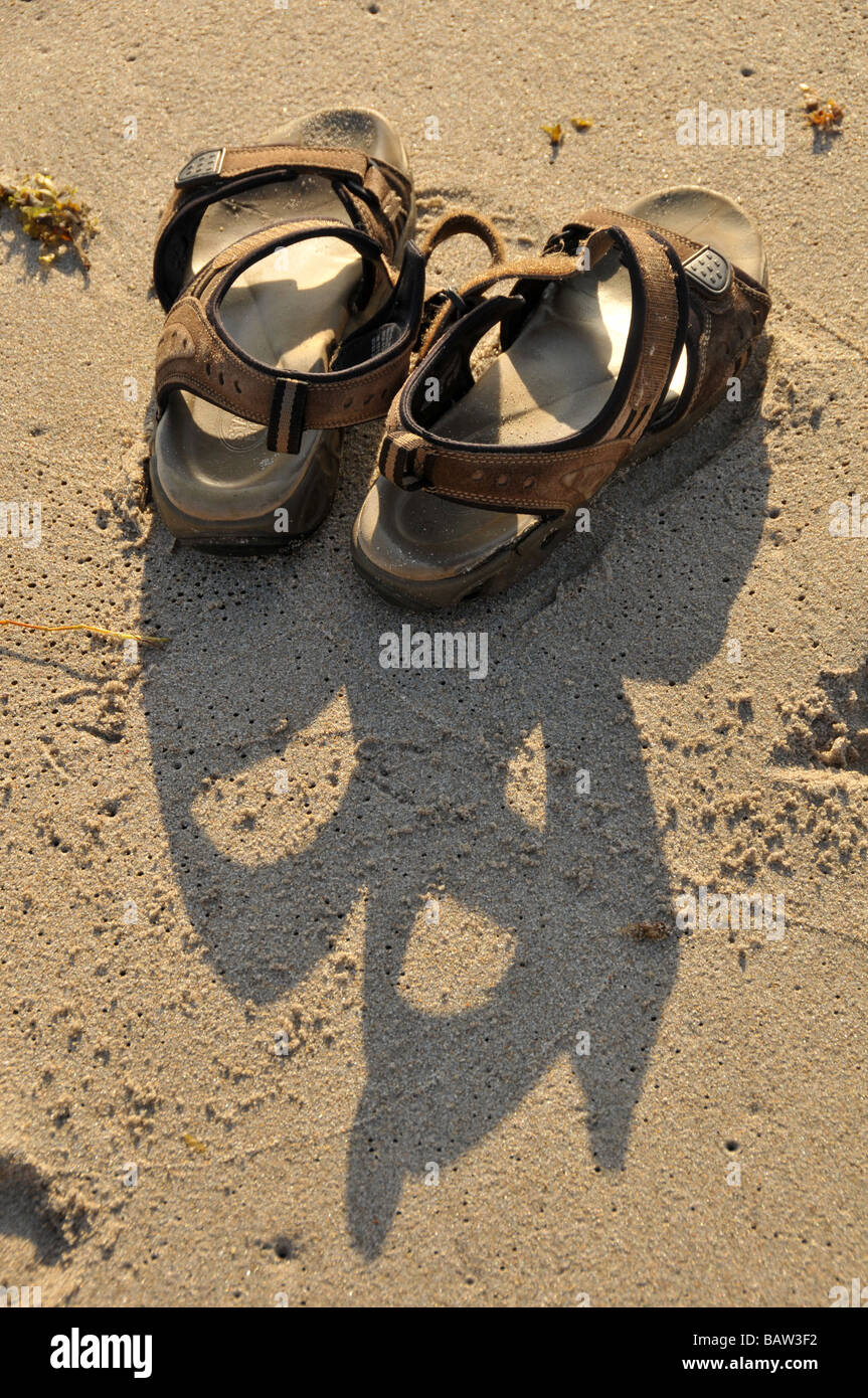 A pair of sandals on the beach Stock Photo - Alamy