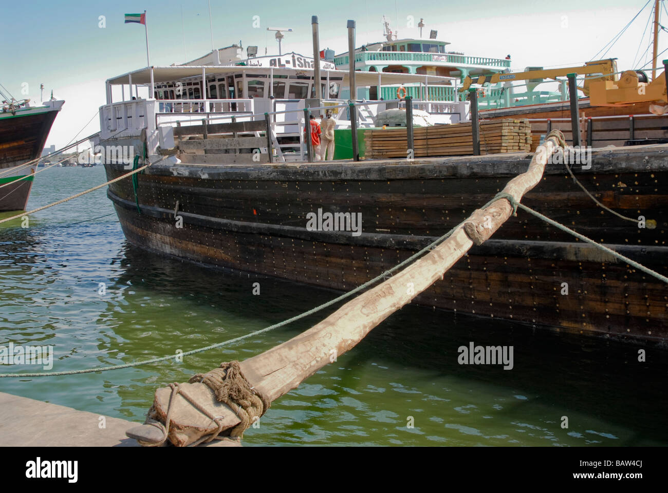 Dhow with a trunk of a tree to gon on board, The Creek, Dubai, UAE ...