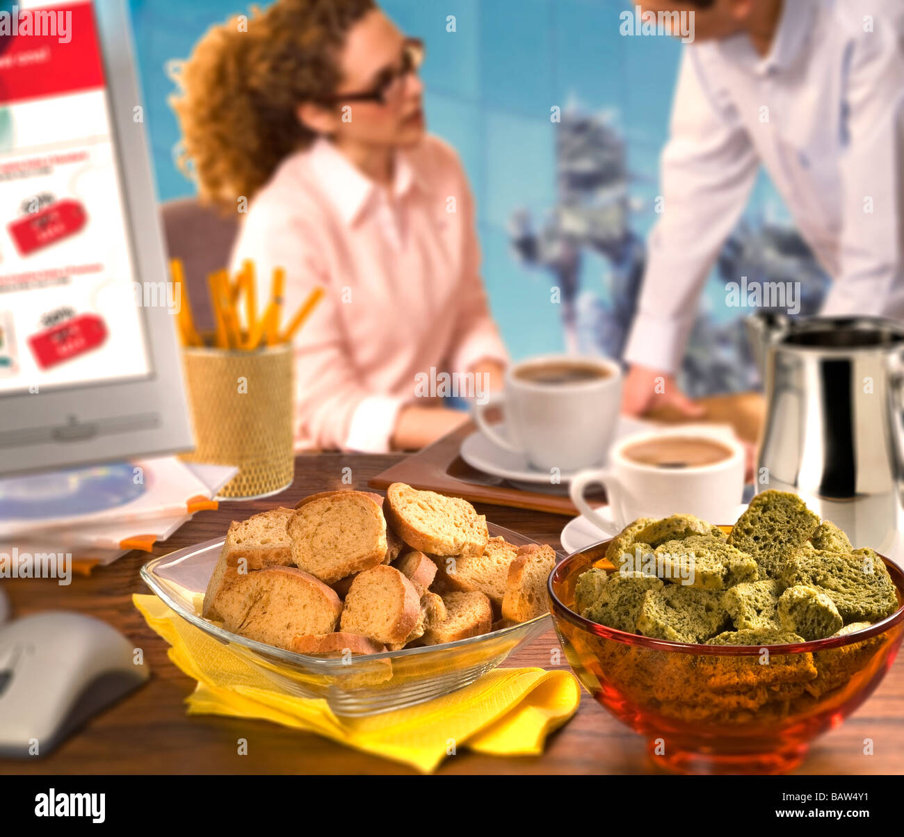 Having snack in the office Stock Photo - Alamy