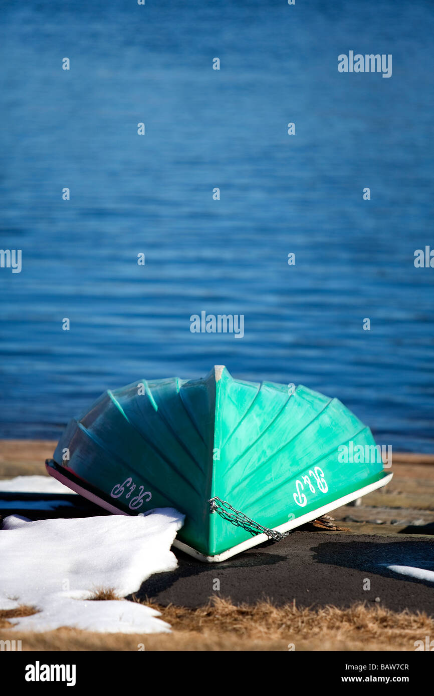 Upturned moored fiberglass green rowboat ( skiff / dinghy Stock Photo ...