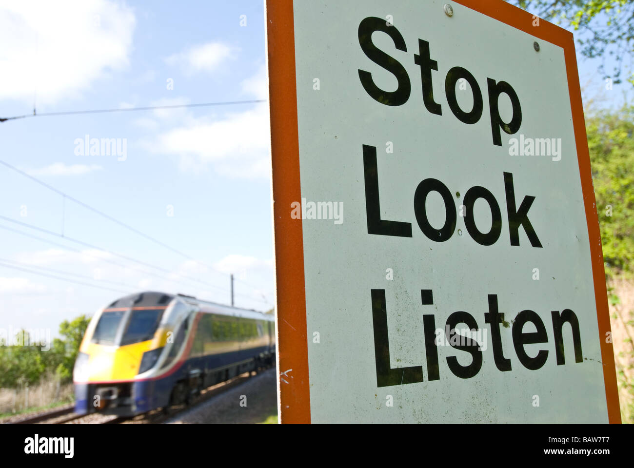 Stop, Look & Listen Train coming Stock Photo - Alamy