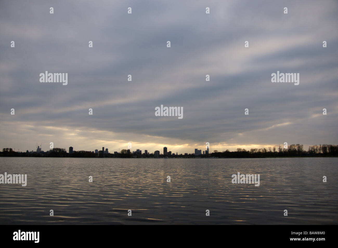 Rotterdam skyscraper buildings evening ripped sky ray lights dark ...