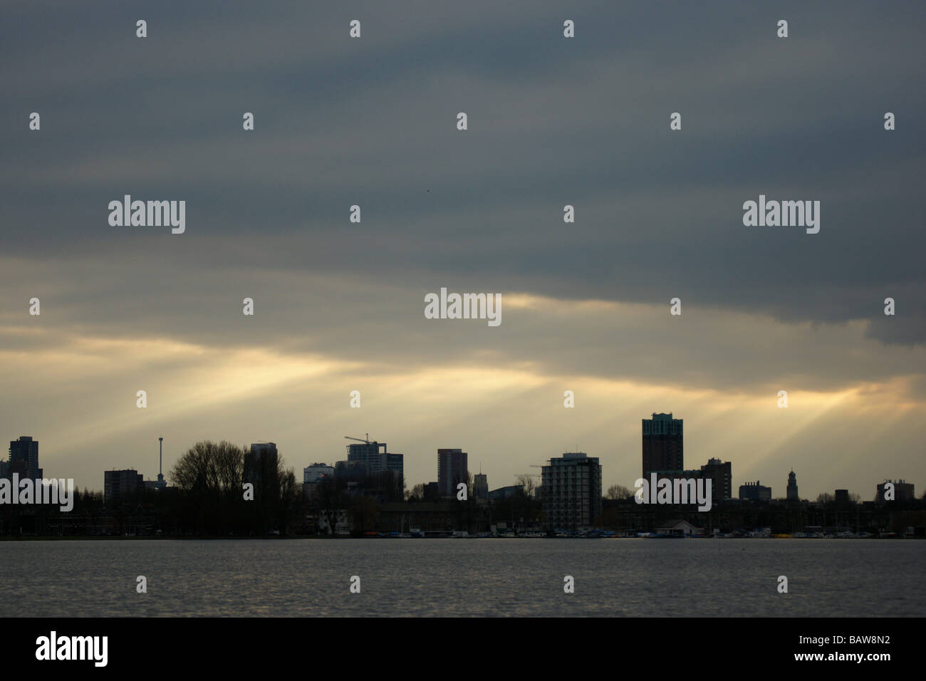 Rotterdam skyscraper buildings evening ripped sky ray lights dark ...