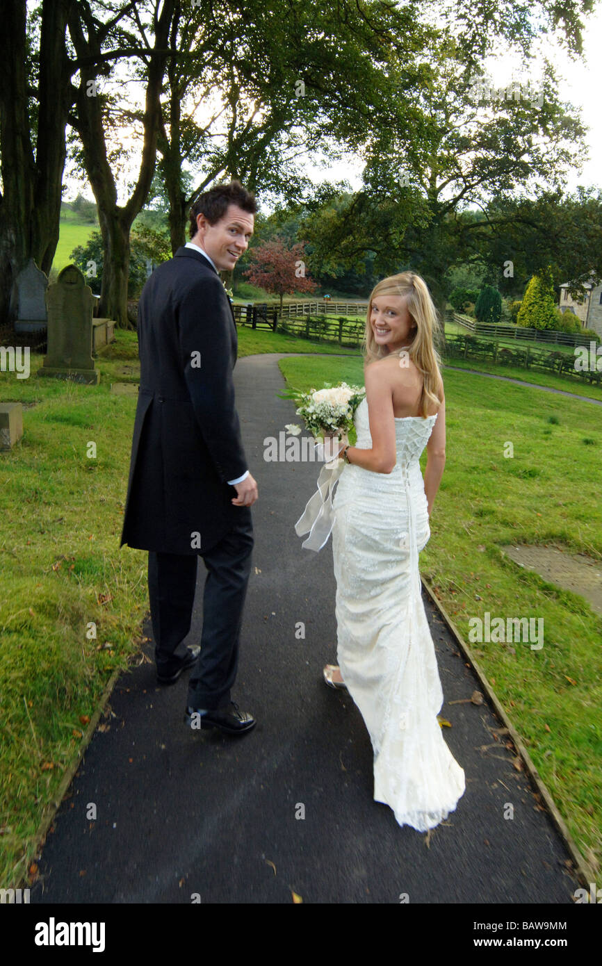 Young couple of newly weds just married at the church, North Yorkshire ...