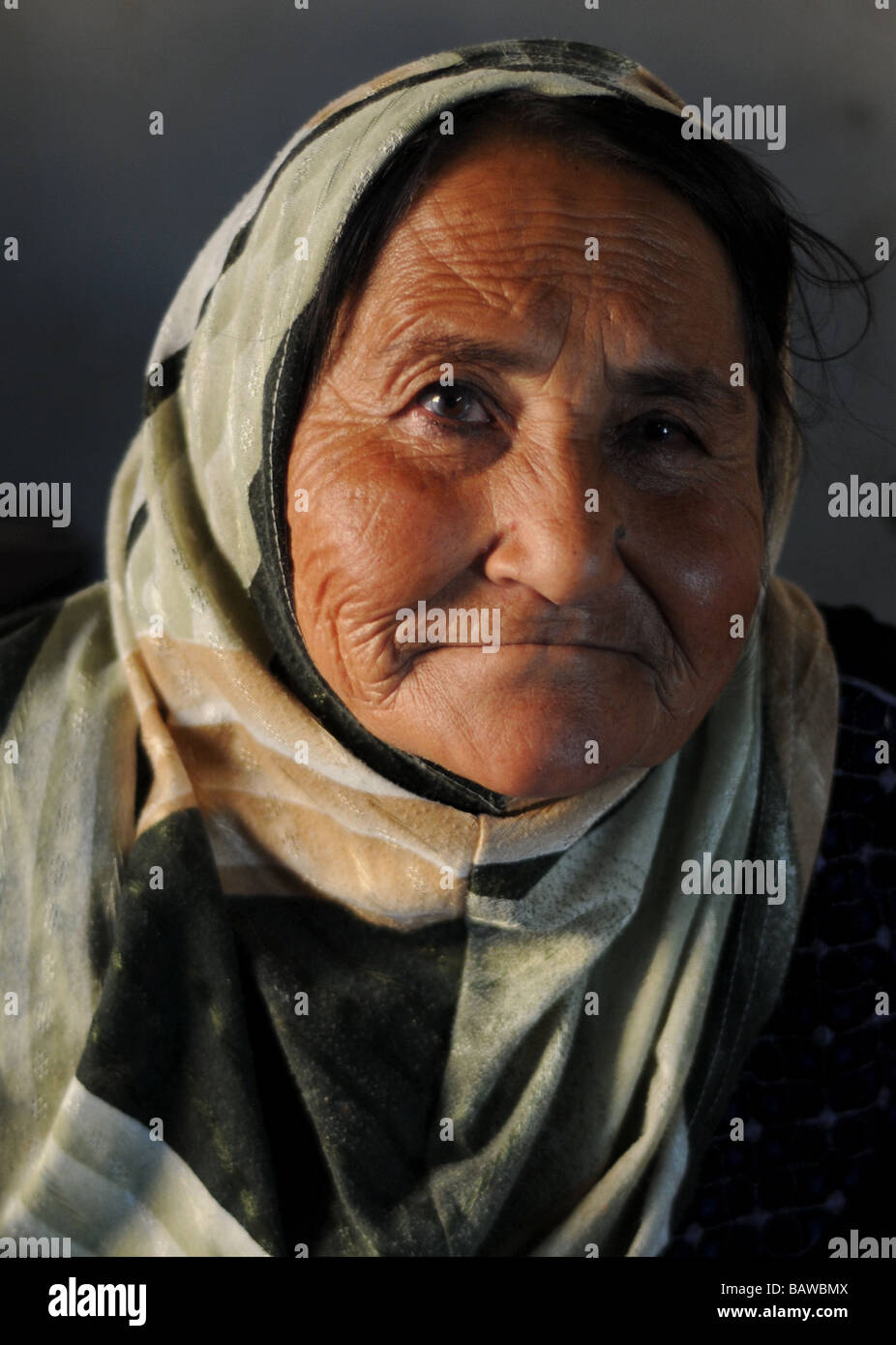 An old Palestinian lady sits in her home in Beit Hanina, Jerusalem. Her ...